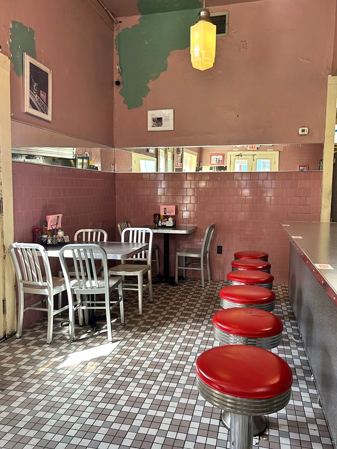 Pink-tiled nostalgia with aluminum chairs and red vinyl stools &ndash; where the d&eacute;cor hasn't changed because nobody wants it to.