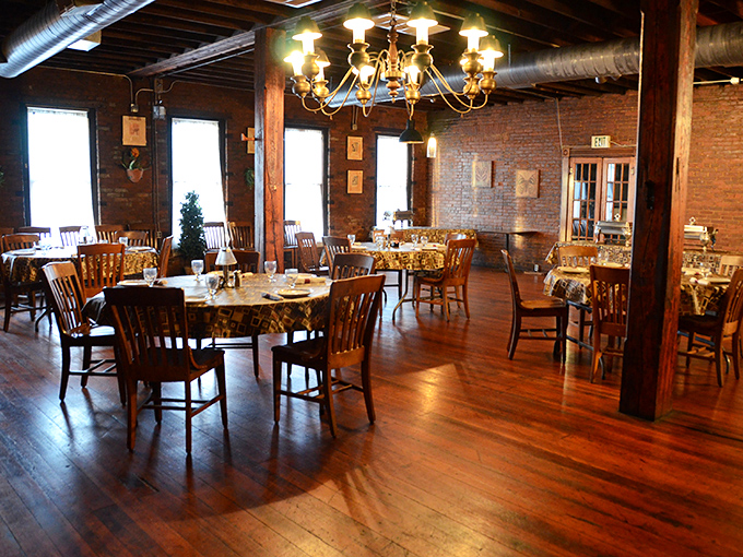 The dining room balances rustic charm with refined comfort, where exposed brick and wooden beams tell stories of Terre Haute's past.