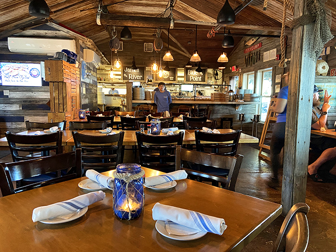 Wooden beams, fishing nets, and warm lighting create the perfect backdrop for seafood stories that get better with each retelling.
