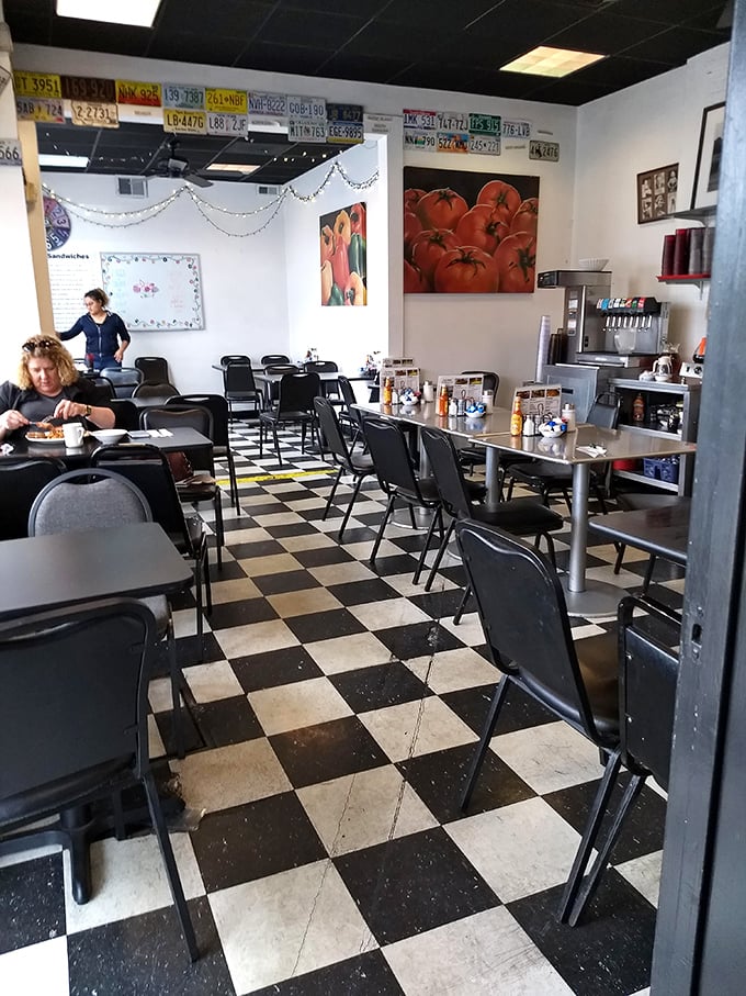 The checkered floor isn't just decoration&mdash;it's a chessboard where the game is deciding what delicious dish to order next.