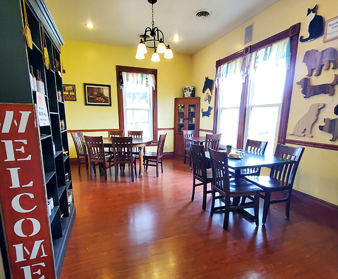 The dining room's sunny yellow walls and wooden accents create the perfect backdrop for serious eating. Note the "Welcome" sign&mdash;they mean it.