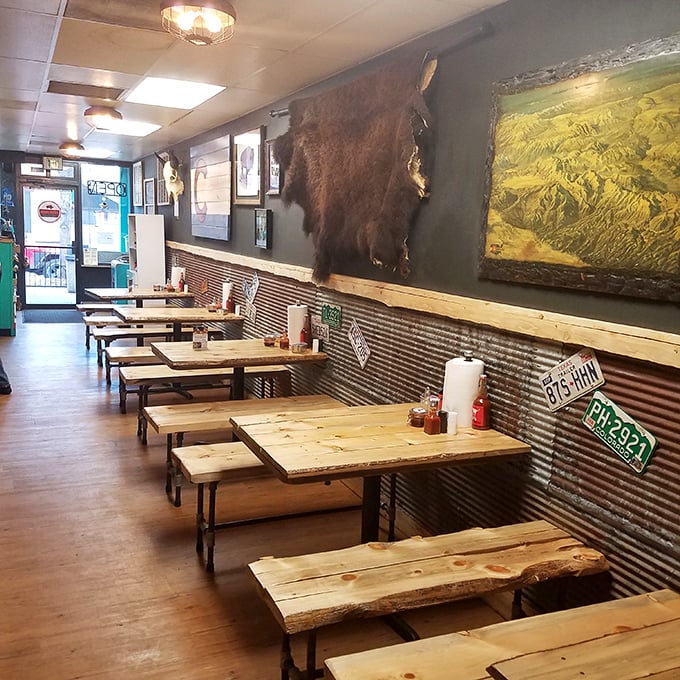 White tablecloths meet cherry-wood chairs in a dining room that says "special occasion" without whispering "second mortgage." The wine rack stands ready for celebration.