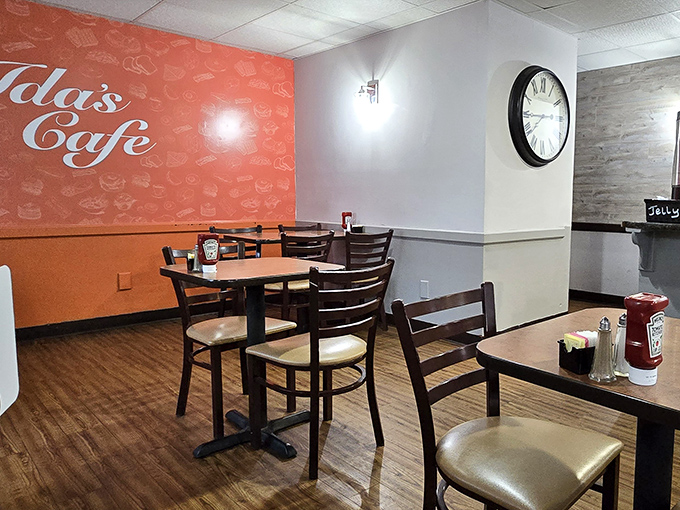 The coral accent wall adds warmth to Ida's interior, where every table feels like the best seat in the house.
