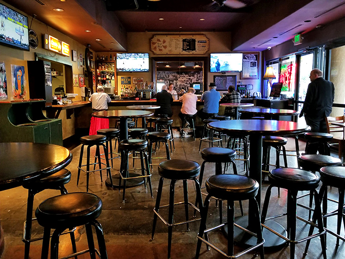 The bar area: where strangers become friends and friends become family, all bonded by the universal language of good pizza and cold beer.