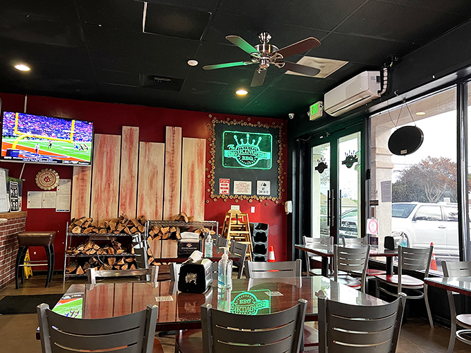 Wooden accents, sports on TV, and stacked firewood&mdash;the dining room feels like the den of your coolest barbecue-obsessed friend.