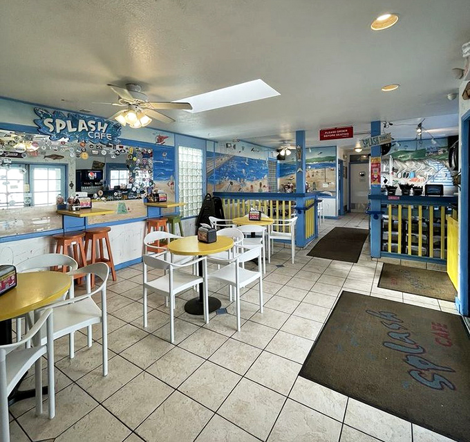 Blue trim, yellow tables, and enough natural light to make even the most camera-shy meal look Instagram-worthy. Casual perfection by the sea.