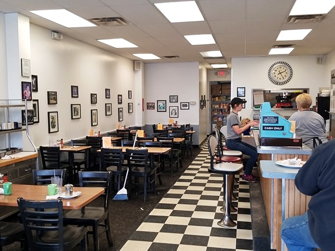 The dining area has that perfect lived-in comfort. Photos on walls tell stories while the counter beckons with its row of stools.