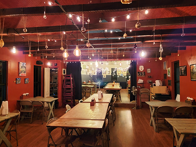 The dining room feels like the living room of that friend who always throws the best parties—warm lighting, communal tables, and the promise of good times.