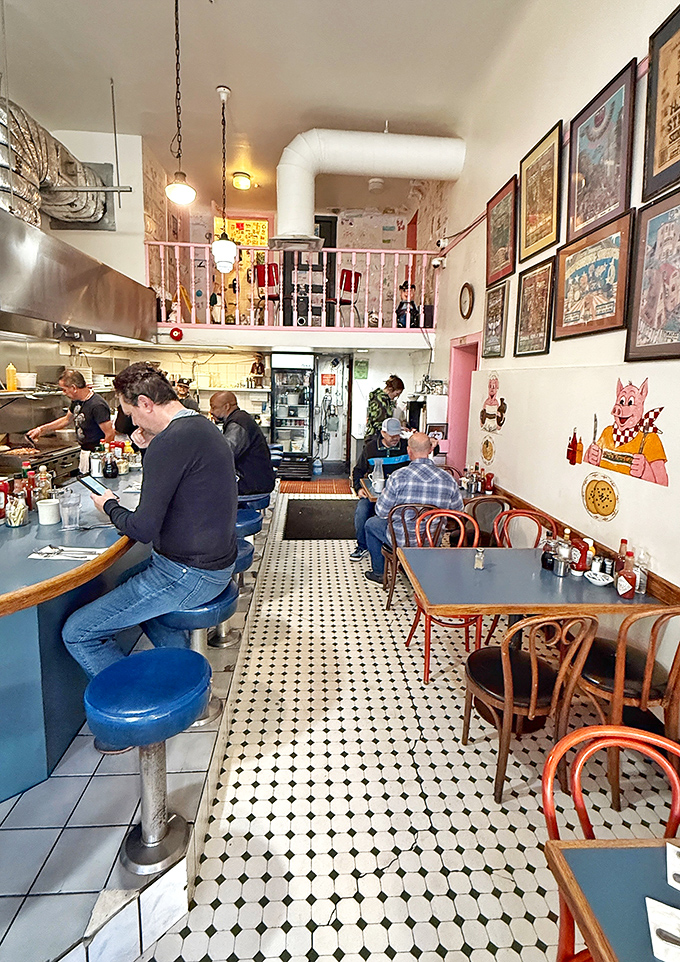 The counter seating offers front-row tickets to the breakfast show, where cooks perform the morning ballet of flipping, grilling, and plating.