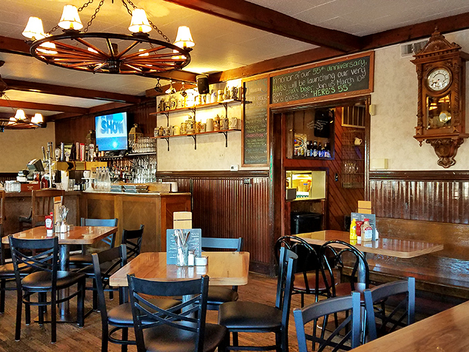 Wagon wheel chandeliers and wood paneling create that perfect "Cheers" vibe where everybody might not know your name yet, but they soon will.