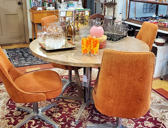 Mid-century modern perfection in burnt orange. This dining set isn't just furniture&mdash;it's a portal to cocktail parties and family dinners from the Space Age. 