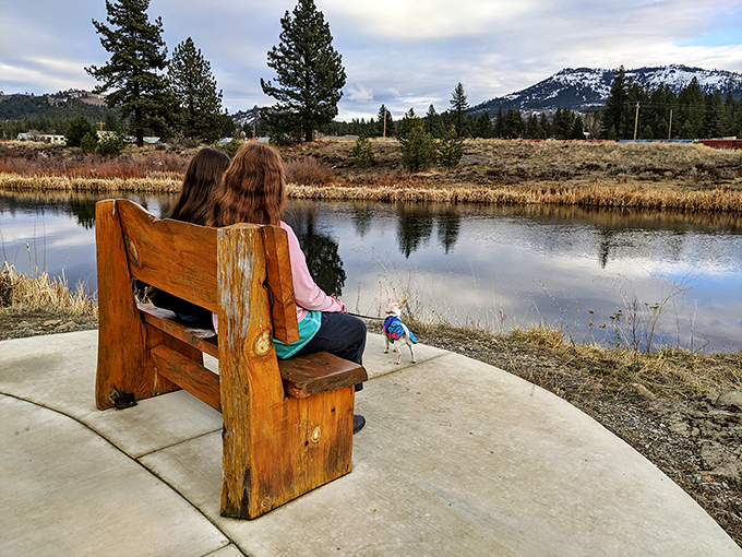 Contemplation comes easy when your bench view includes mountains, water, and not a single notification from your boss.