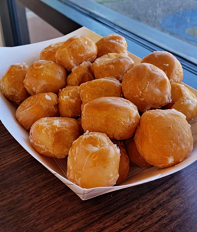 Donut holes piled high like edible marbles. These bite-sized beauties prove that sometimes the best things come in small, glazed packages.