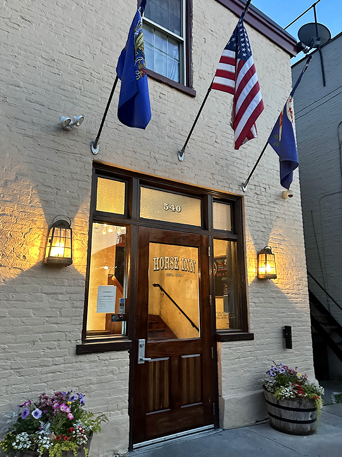 Flags flutter above the entrance like a subtle announcement: "Something special happens here," and they're absolutely right.