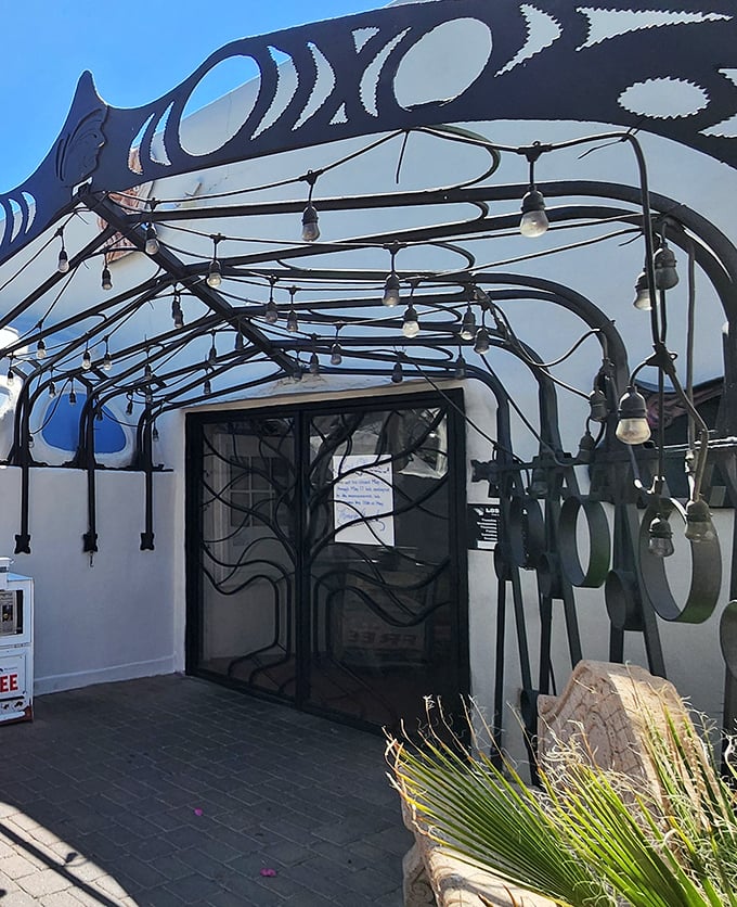 The entrance's wrought-iron details and artistic flair set the stage for the culinary performance waiting inside.