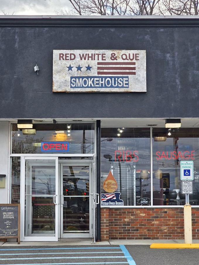 The storefront might be humble, but that "OPEN" sign is the most beautiful word in the English language when barbecue cravings hit.