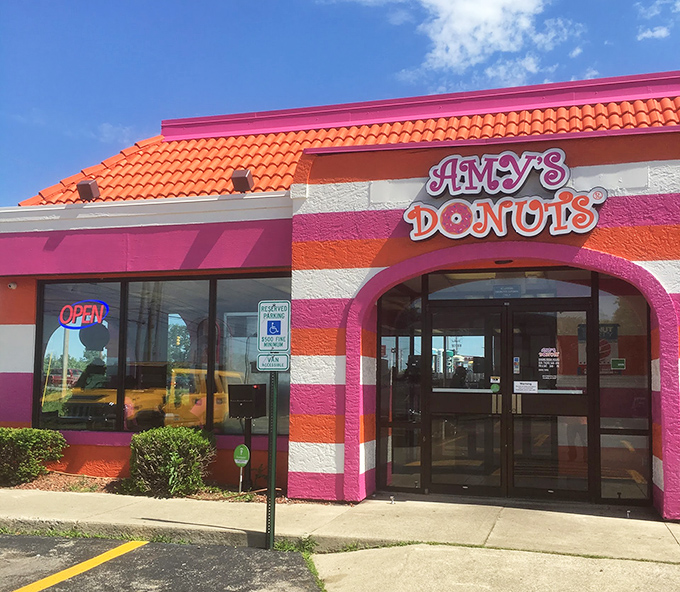 Even in summer sunshine, the orange roof and pink stripes of Amy's stand ready to fulfill your deepest donut desires.