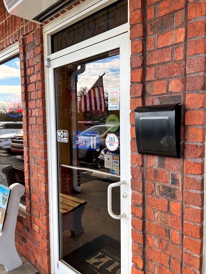 The entrance speaks volumes: unpretentious, welcoming, and proudly displaying the American flag&mdash;a portal to burger paradise.