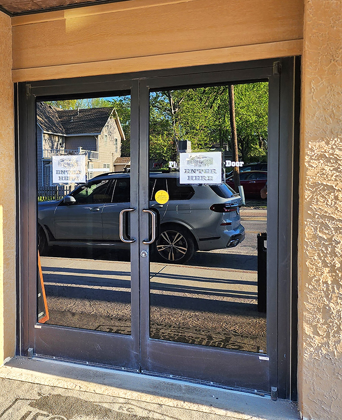 The entrance beckons with simple promise: beyond these doors lies beef paradise. No velvet ropes, just "Enter Here" signs pointing the way to satisfaction.