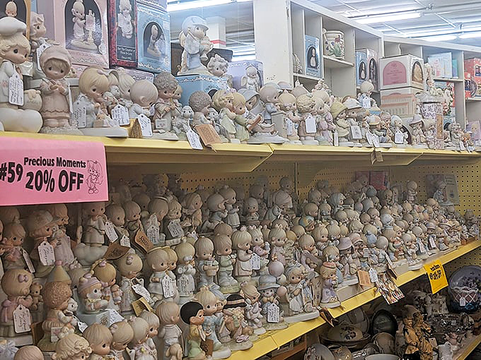 An army of Precious Moments figurines stands at attention, their teardrop eyes silently judging your life choices since 1978.