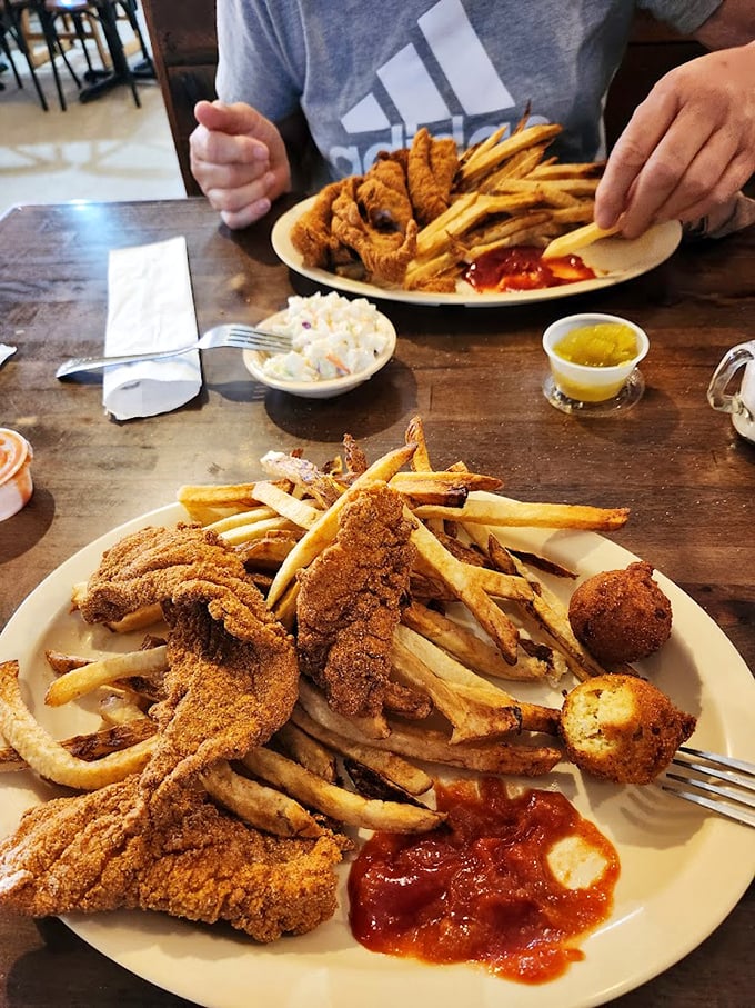 Golden-fried catfish and crispy fries&mdash;proof that sometimes the simplest pleasures are the most satisfying, especially when served on a no-nonsense white plate.