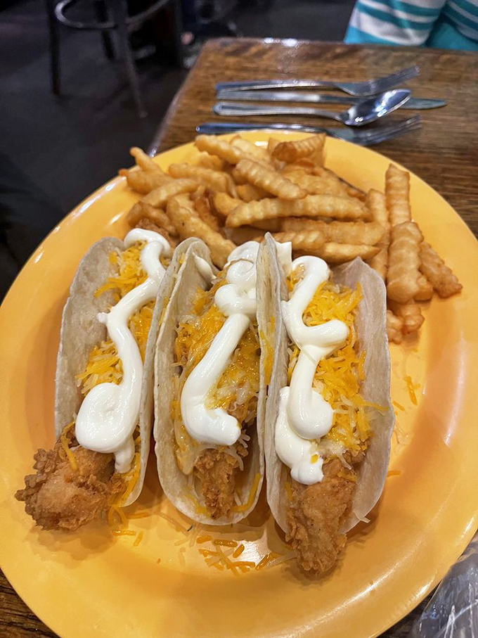 Fish tacos that bring together the best of two culinary worlds &ndash; crispy fish, melted cheese, and a drizzle of sauce that makes Wednesday taste like the weekend.