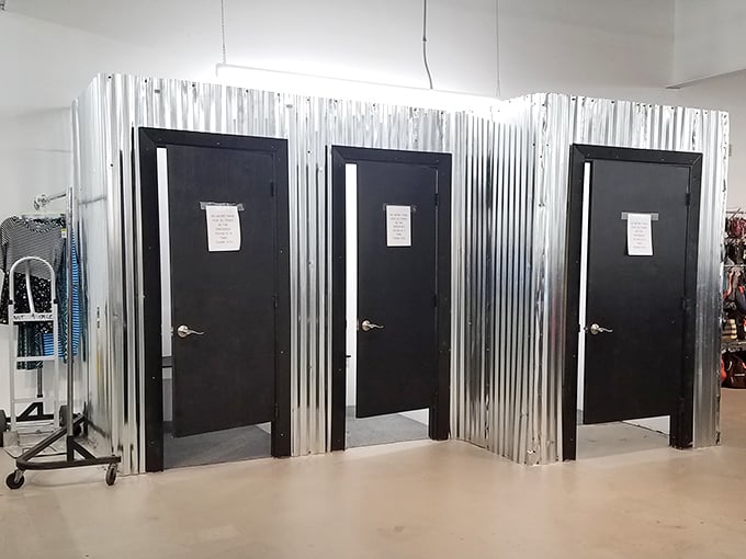 Fitting rooms with industrial chic flair. What happens behind these corrugated metal doors? Fashion magic or reality checks&mdash;sometimes both!
