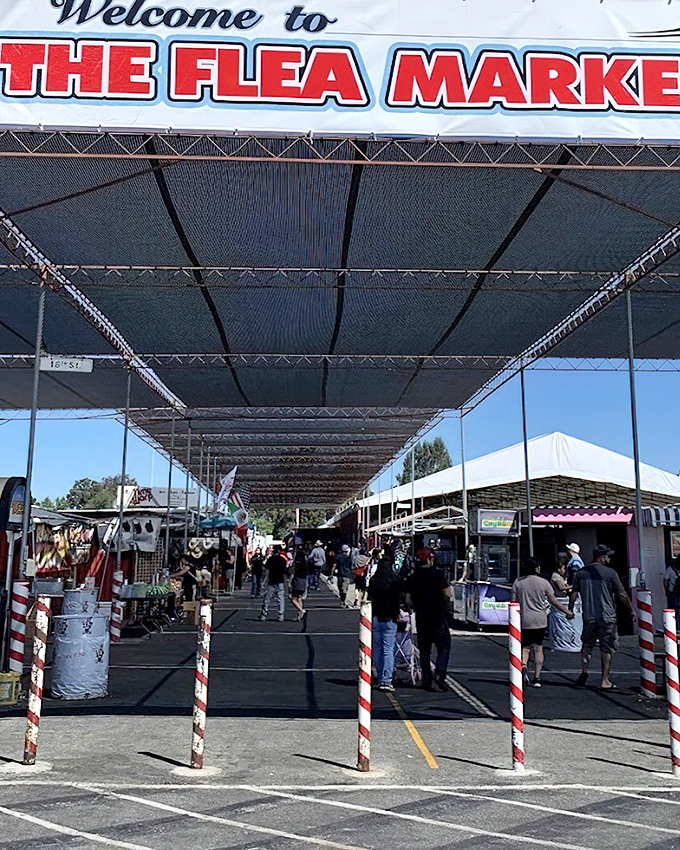 The gateway to retail adventure. Shoppers stream into the covered marketplace like explorers entering a new world of possibilities and potential bargains.