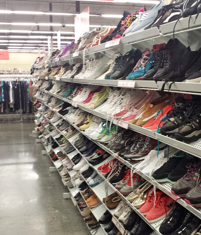 The shoe wall&mdash;a footwear fantasy where hiking boots that have summited mountains sit beside pristine pumps that never left the closet.