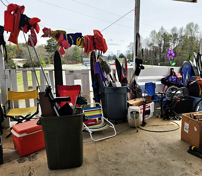Outdoor gear and colorful clothes hanging under the porch, because even the overflow area gets creative at this place.
