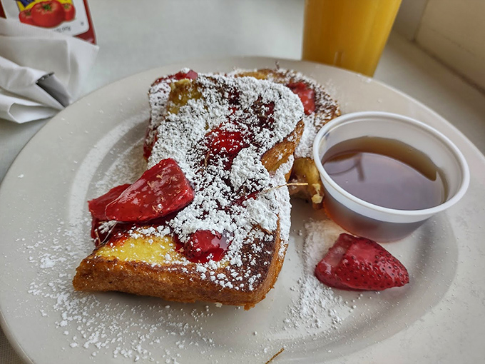 French toast that's dressed for success with fresh strawberries and a dusting of powdered sugar&mdash;breakfast that thinks it's dessert.