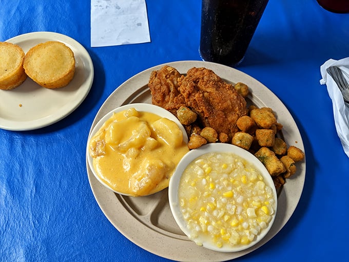 Fried chicken so perfectly golden it could star in its own cooking show, surrounded by sides that deserve equal billing.