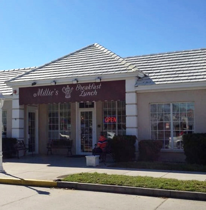 Morning sunshine illuminates Millie's welcoming entrance, where Florida's breakfast devotees gather like pilgrims at a temple of toast and eggs.