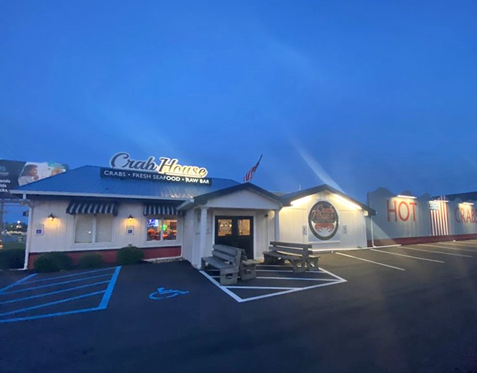 As dusk settles, the Crab House's "HOT CRABS" sign glows like a neon promise of delicious things to come.