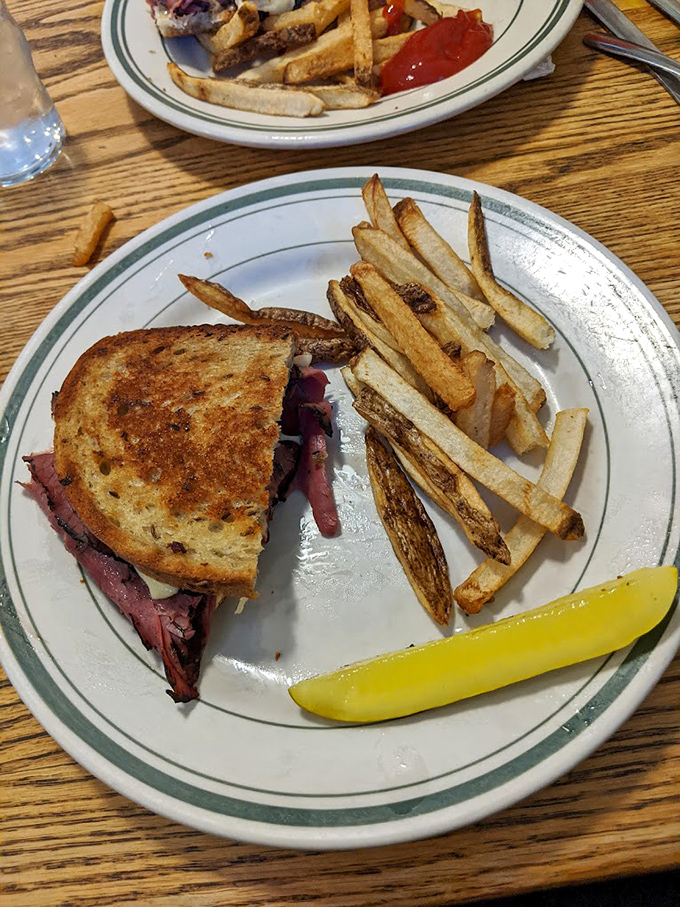 A grilled Reuben that achieves that perfect balance &ndash; tangy sauerkraut, savory corned beef, and bread toasted to golden perfection.