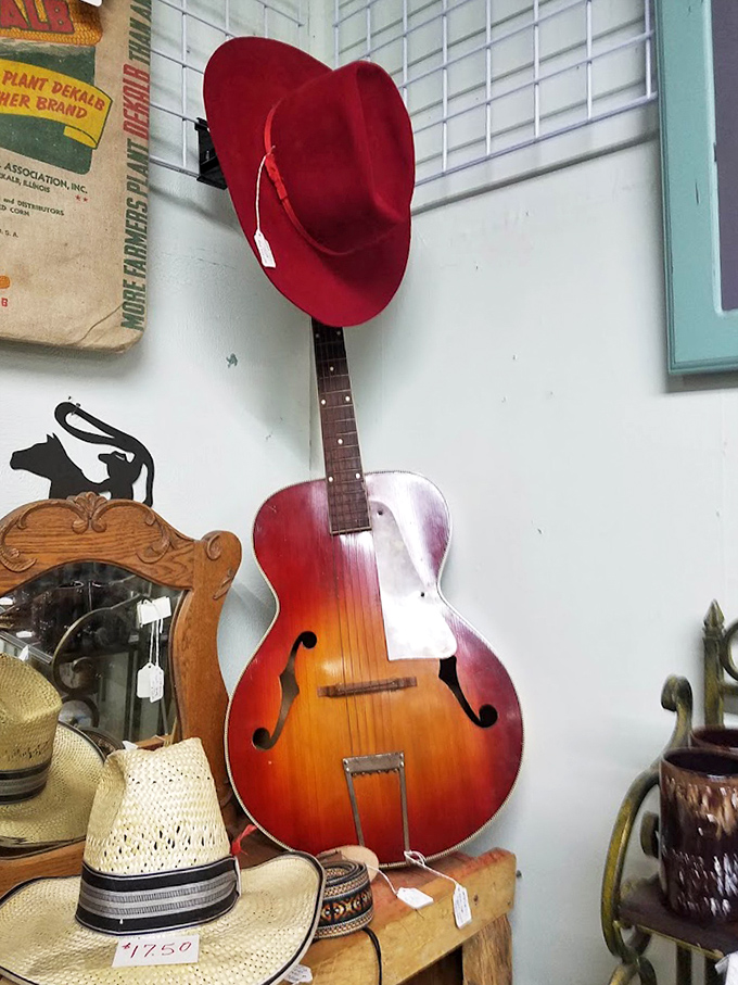 That gorgeous vintage guitar practically begging someone to take it home and make music the old-fashioned way again. 