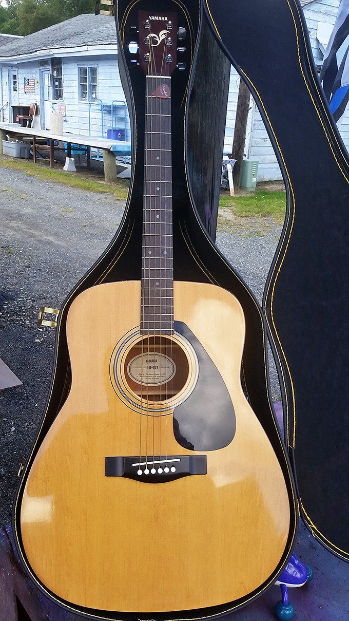 Six strings of possibility. This Yamaha acoustic guitar waits for its next owner to strum away a Sunday afternoon.