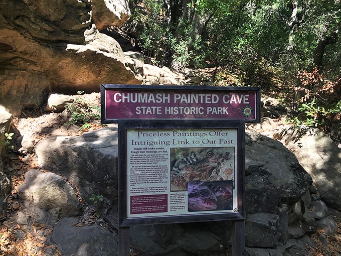 This informational display offers context for the cave's remarkable paintings, though no placard can fully capture the spiritual significance of this sacred space.