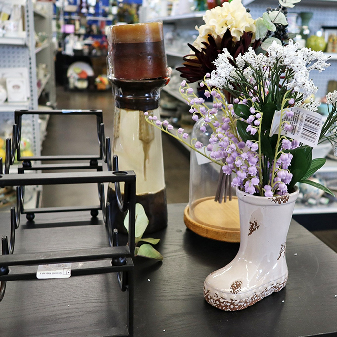 A porcelain boot blooms with artificial flowers beside mysterious glass-domed curiosities&mdash;the home d&eacute;cor section is where whimsy meets practicality.
