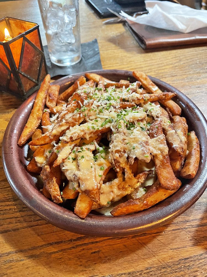 These aren't just fries; they're a crispy canvas for cheese and herb artistry that demands attention.