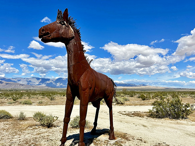 This rusty steed stands proud against cloudy skies, its mane forever windblown in the desert breeze.