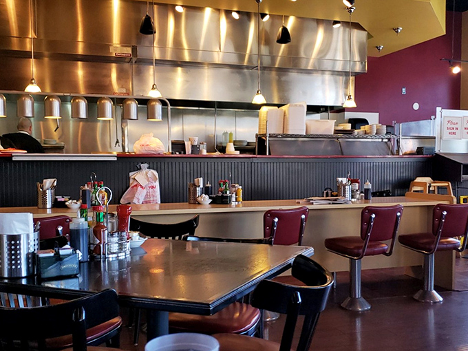 The counter seating offers front-row tickets to breakfast theater, where spatulas flip with the drama of Broadway batons.