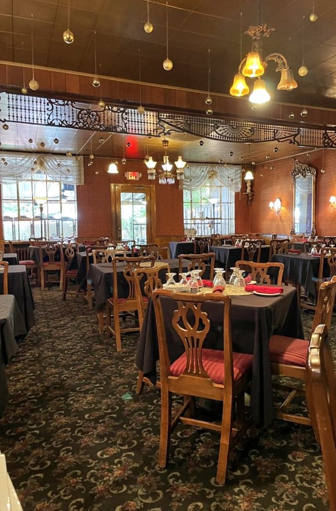 The dining room feels like it's hosting a perpetual family celebration, with ornate details overhead that have witnessed countless "grazie" and "salute!"