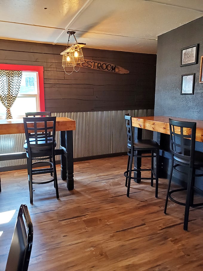 Rustic charm defines the dining area, where a surfboard-turned-restroom-sign reminds you this is a place with personality to spare.