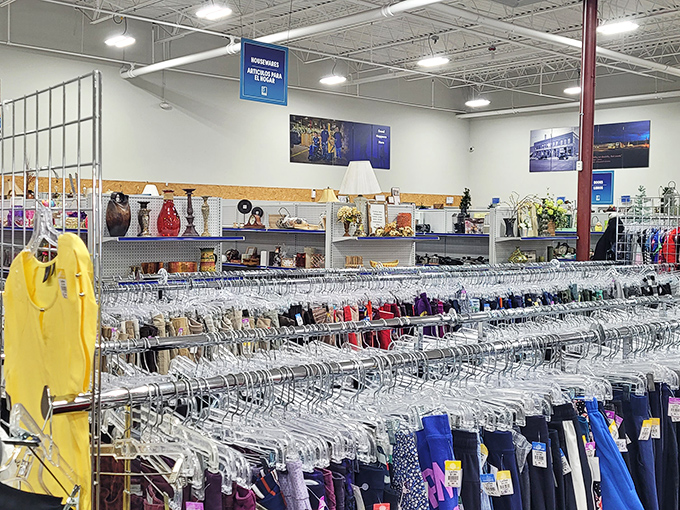 Clothing racks create a labyrinth of possibilities with home décor treasures lining the walls. The thrill of the hunt is half the fun.