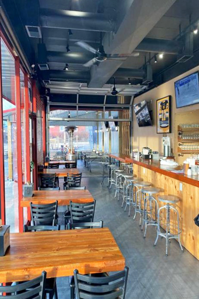 The wooden bar and industrial ceiling create that sweet spot between "nice enough for date night" and "casual enough for Tuesday lunch."