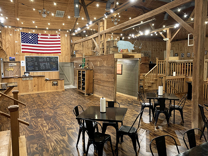 American flag, wooden beams, and string lights—the universal language for "relax, you're among friends who take their meat seriously."