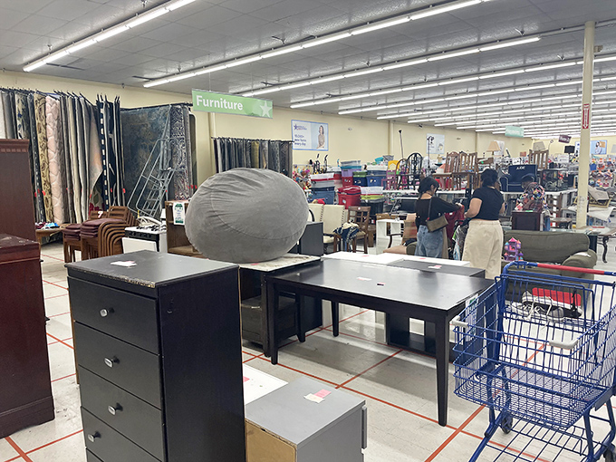 Tables, dressers, and bean bag chairs create an eclectic furniture showroom. That desk might have written someone's novel before landing here.