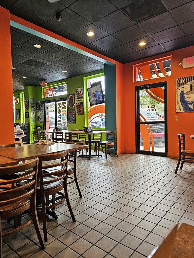 The dining area's playful color scheme and clean lines create an atmosphere that says, "We're serious about pizza, not about pretension."