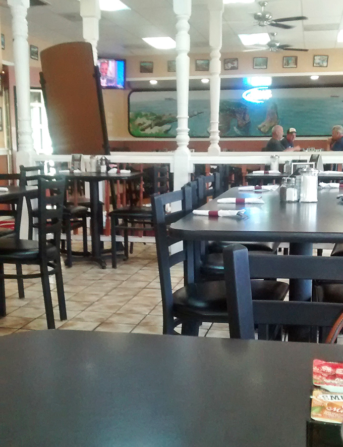 White columns and cozy booths create that perfect diner atmosphere where strangers become neighbors and calories don't count before noon.